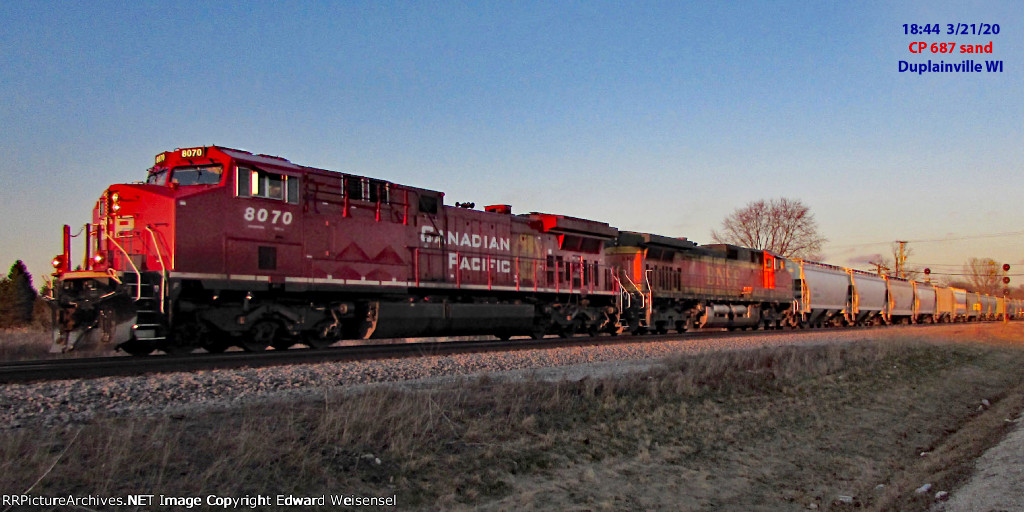 Sand empties roll west in the setting spring sun